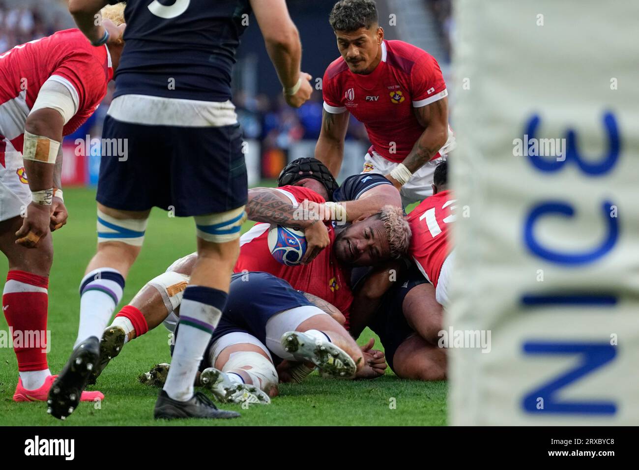 Tonga's Vaea Fifita with the ball is tackled during the Rugby World Cup ...