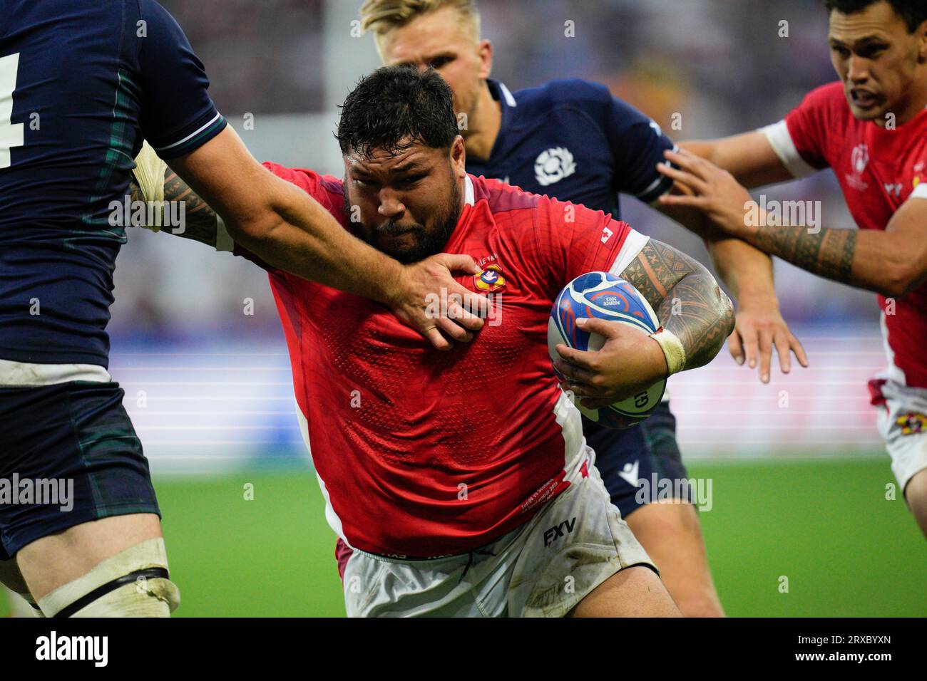 Tonga's Ben Tameifuna runs with the ball to score a try during the ...