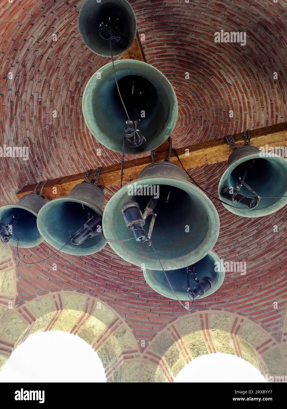 Bottom view of bells with installed microphones on bell tower of ...