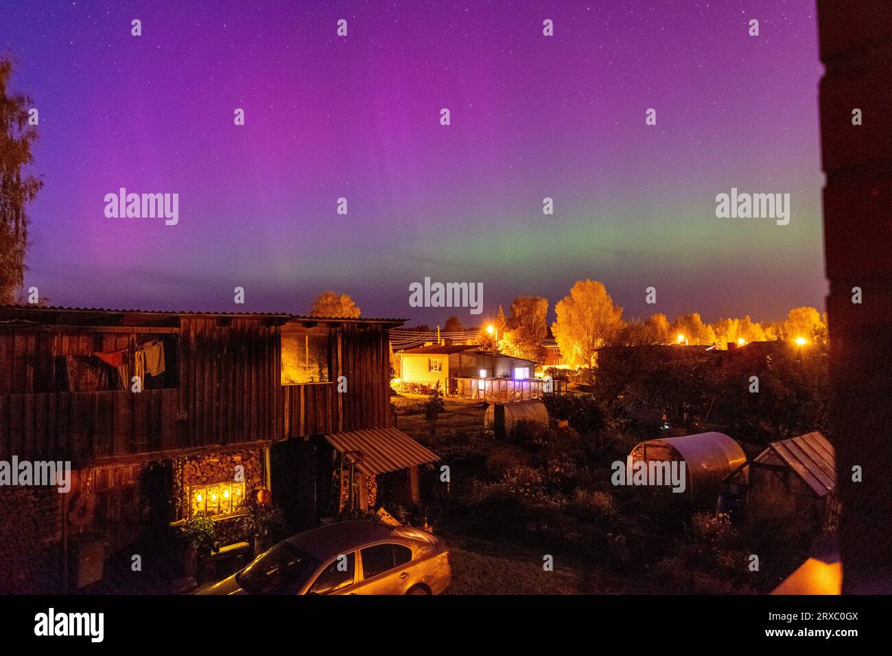 night image of a massive multi-colored green vibrant Aurora Borealis ...