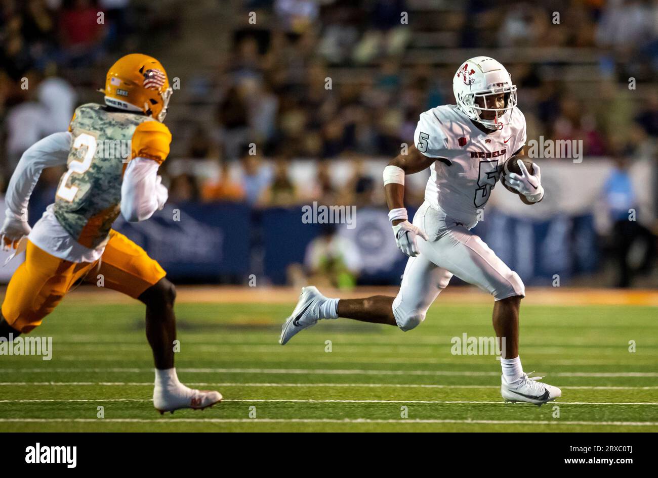 UNLV running back Vincent Davis Jr. (5) runs for yardage chased by UTEP ...