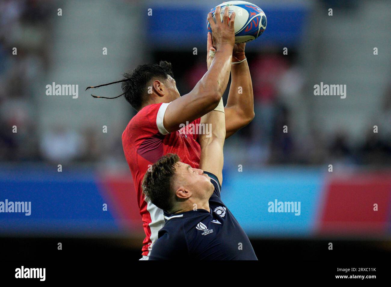 Tonga's Sam Lousi, above, and Scotland's Zander Fagerson fight for the ...