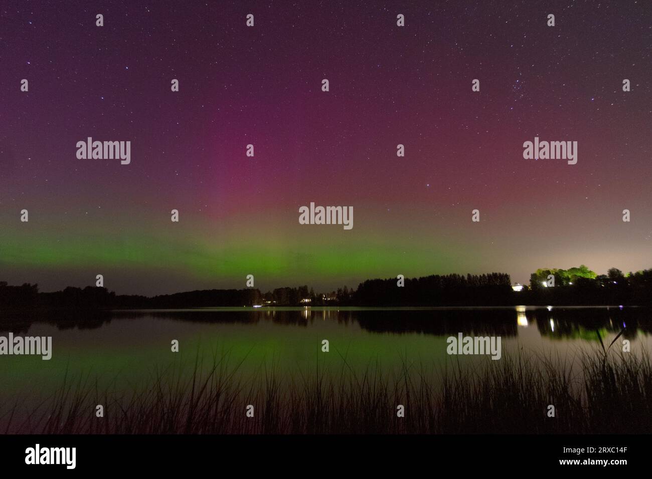 night image of a massive multi-colored green vibrant Aurora Borealis ...