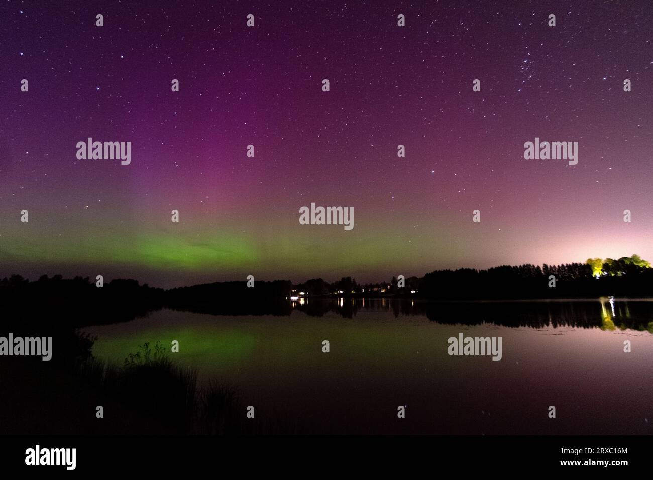 night image of a massive multi-colored green vibrant Aurora Borealis ...