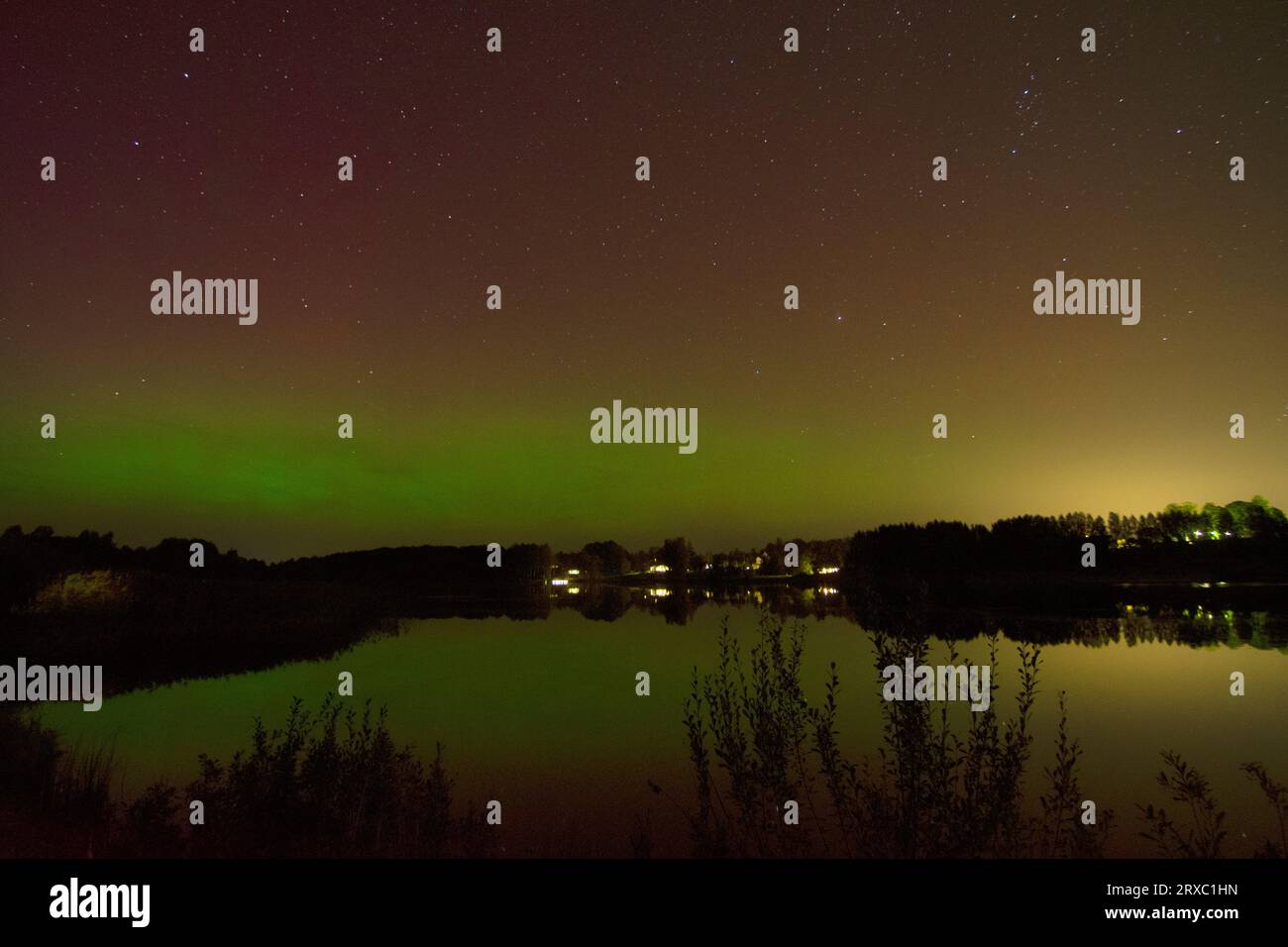 night image of a massive multi-colored green vibrant Aurora Borealis ...
