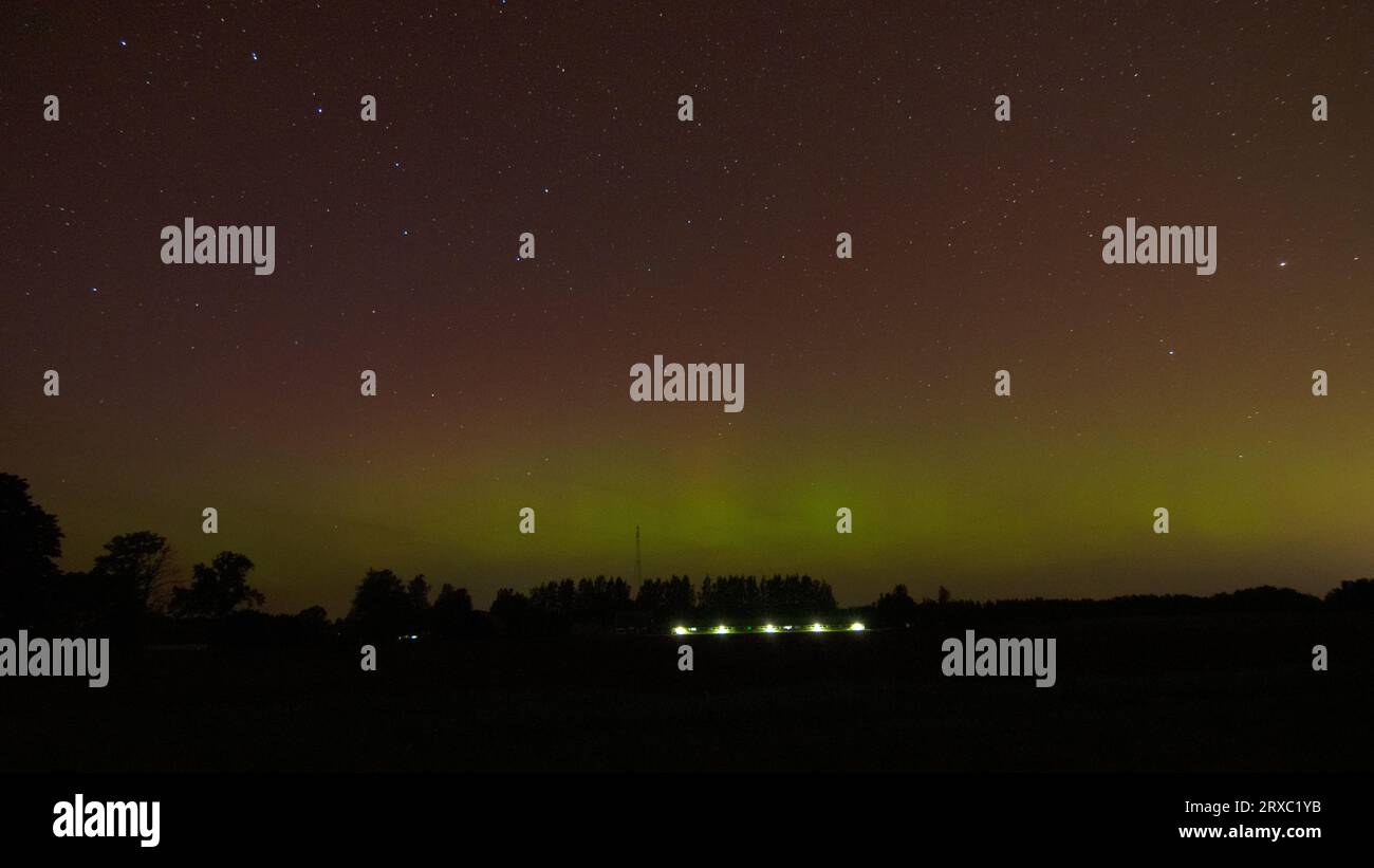 night image of a massive multi-colored green vibrant Aurora Borealis ...