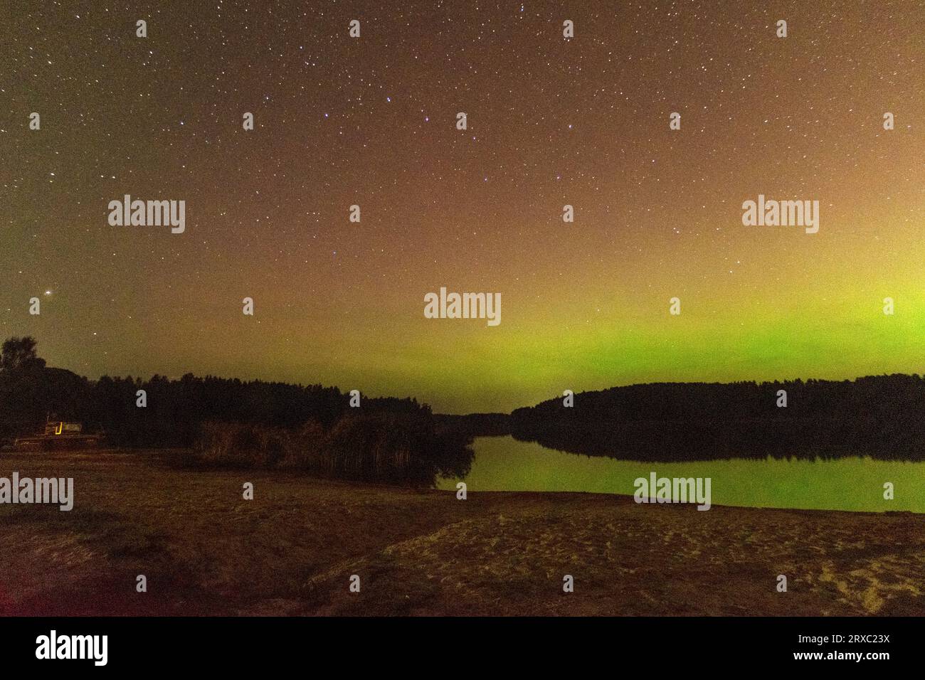 night image of a massive multi-colored green vibrant Aurora Borealis ...