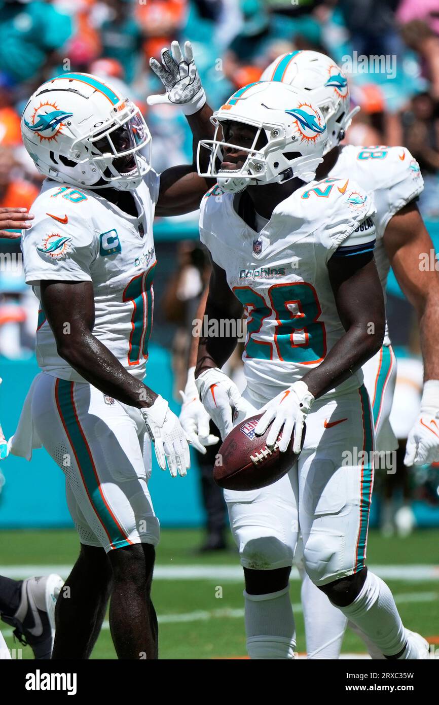 Miami Dolphins running back De'Von Achane (28) is congratulated by wide receiver Tyreek Hill (10 ...
