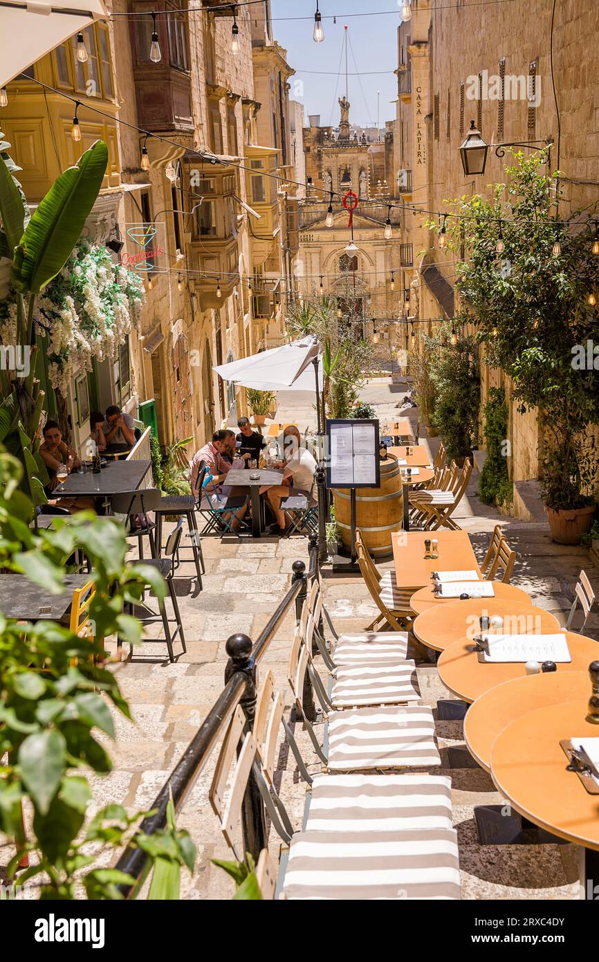 Valletta, Malta - 17 June 2023: Staircase with building and umbrellas ...