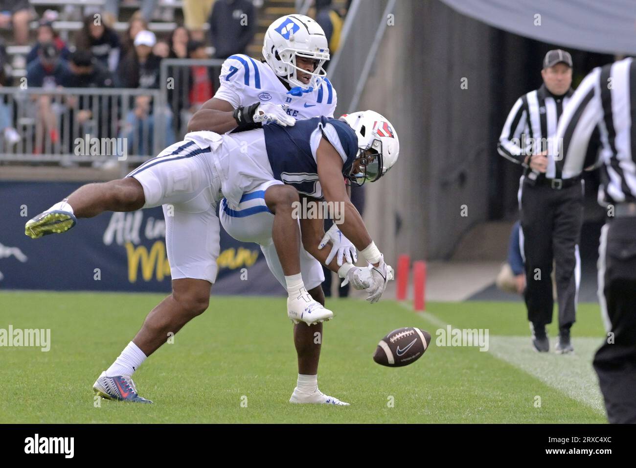 Duke cornerback Al Blades Jr. (7) and Noe Ruelas (17) of UConn grapple ...