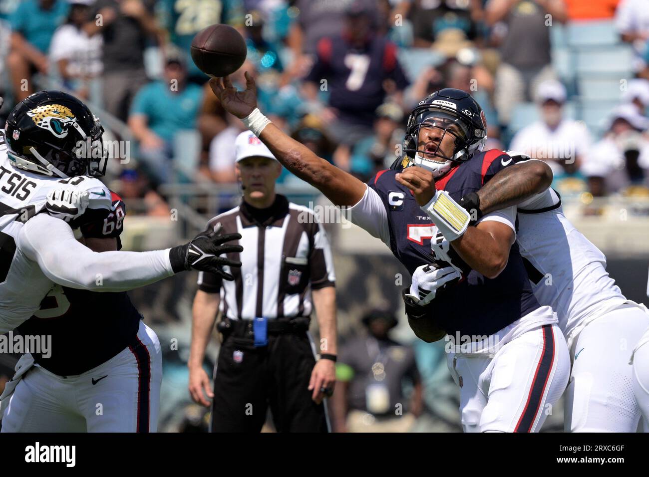 Houston Texans quarterback C.J. Stroud (7) is hit by Jacksonville ...