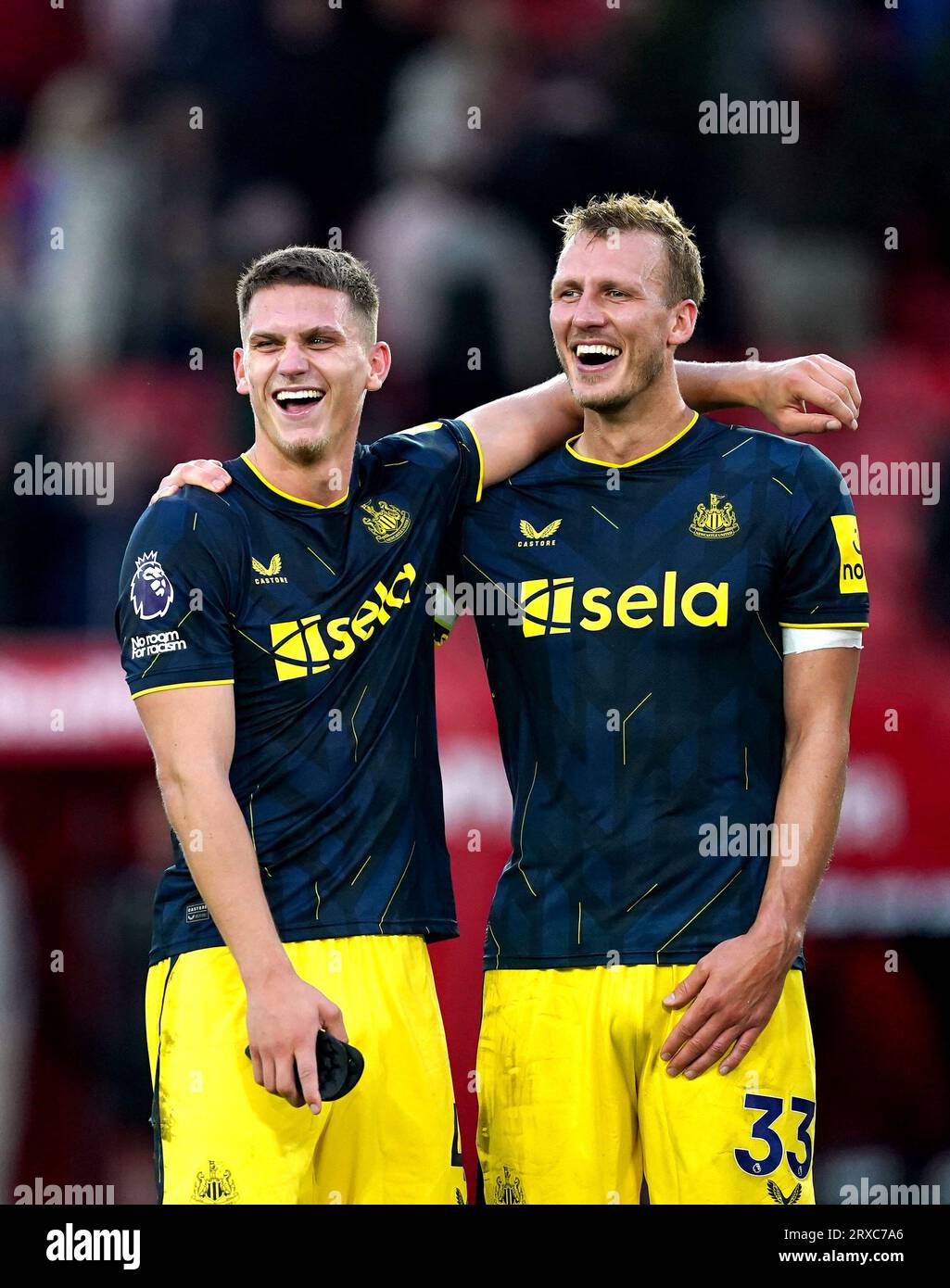 Newcastle United's Sven Botman (left) and Dan Burn at the end of the ...