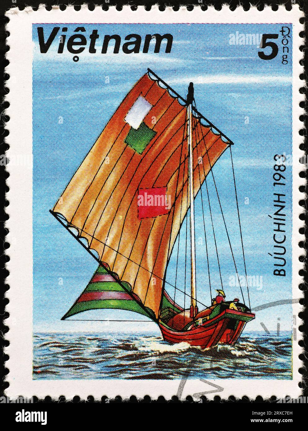 Traditional sailboat on vintage vietnamese stamp Stock Photo - Alamy