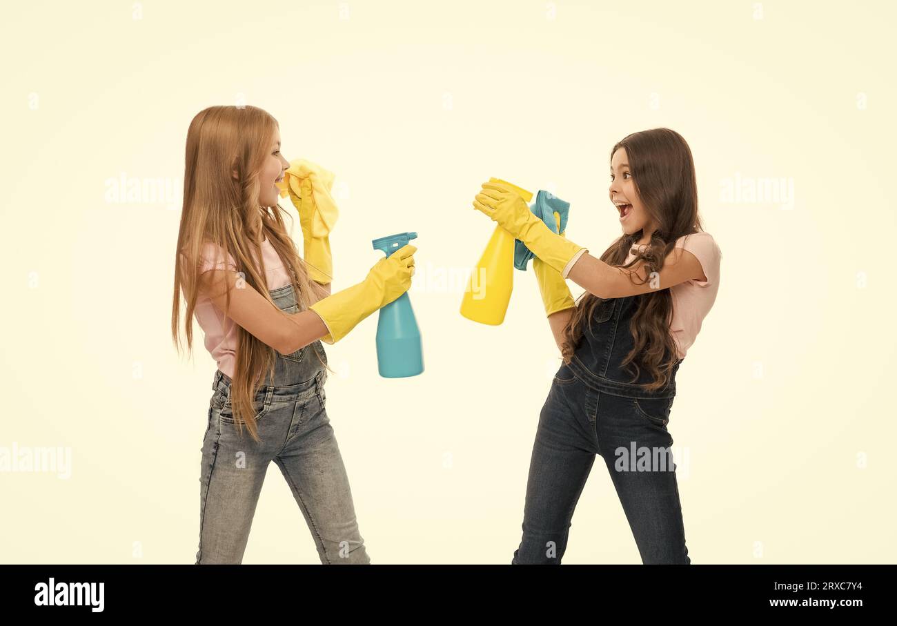 Cleaning products that work. Little girls spraying each other from ...