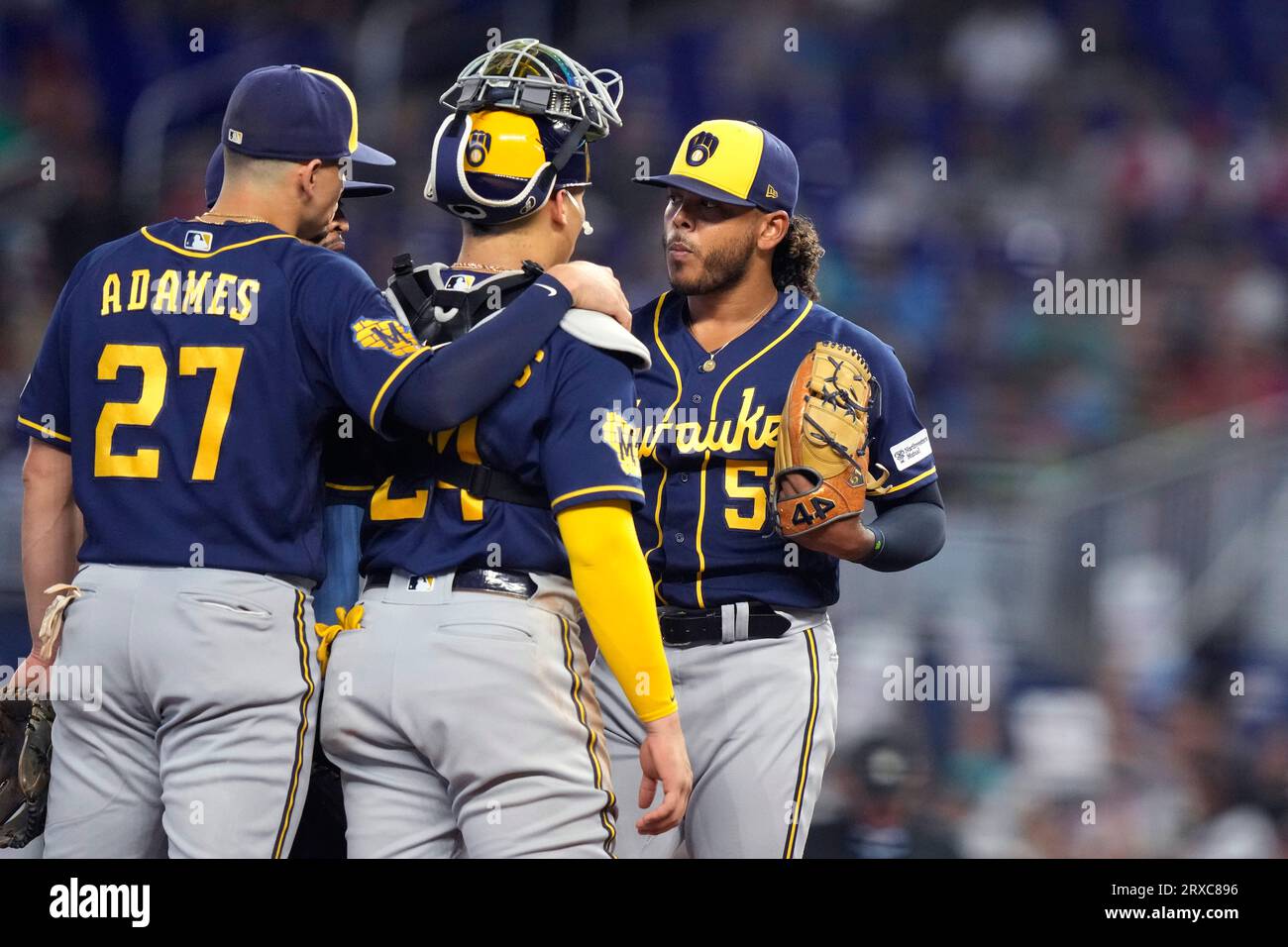 Milwaukee Brewers starting pitcher Freddy Peralta, right, talks with ...