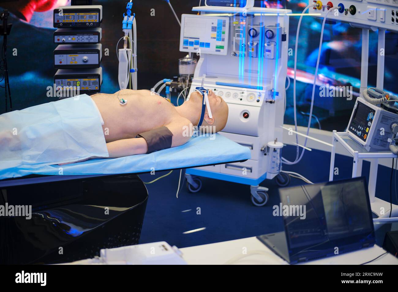 Surgeon in operating room performing operation on the training dummy ...