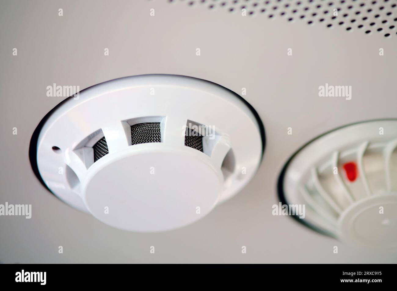 Smoke detector in the train, close up. Fire alarm system on a white ...