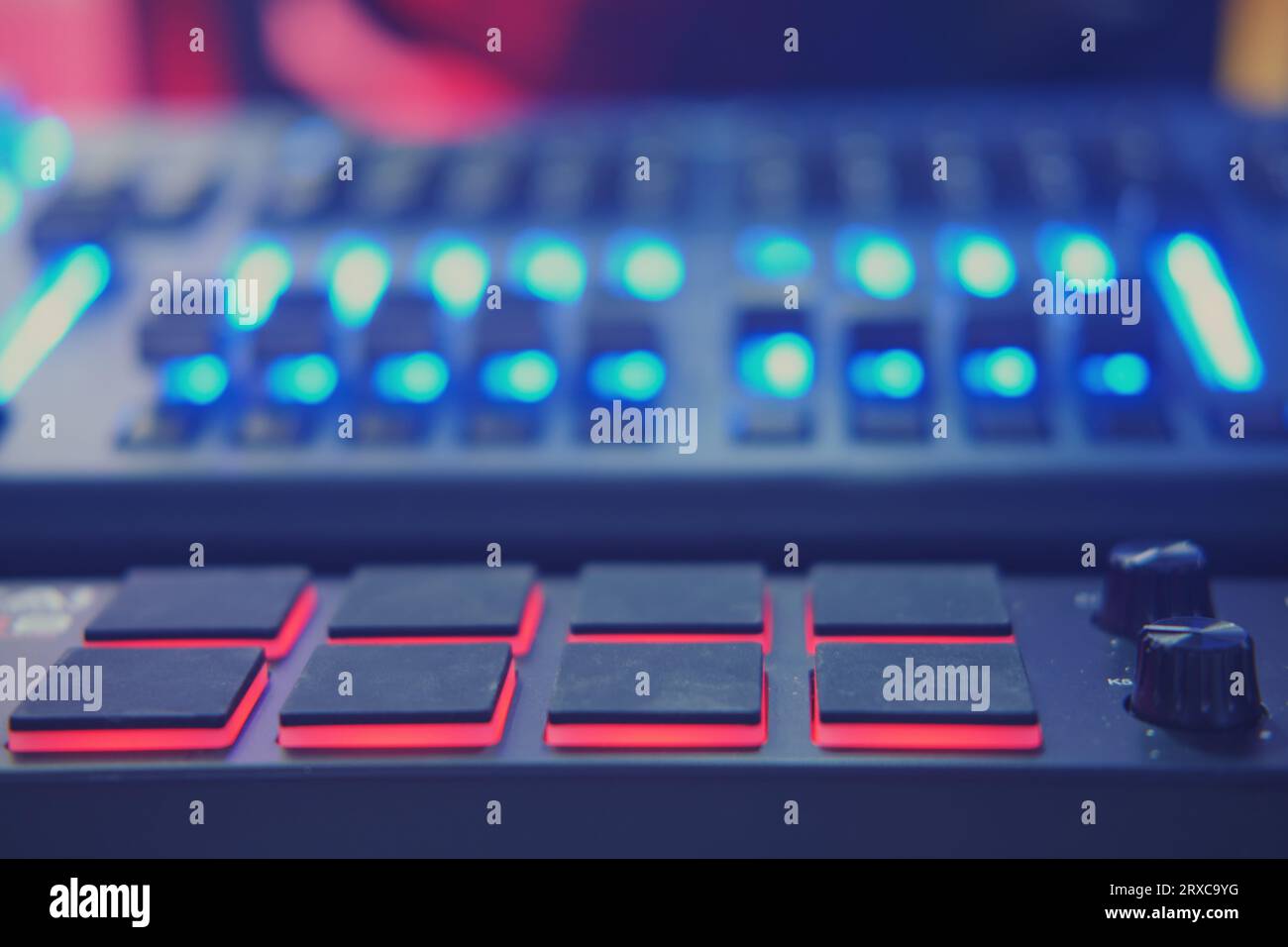 DJ mixer in nightclub with blue and red lights. Close up Stock Photo ...