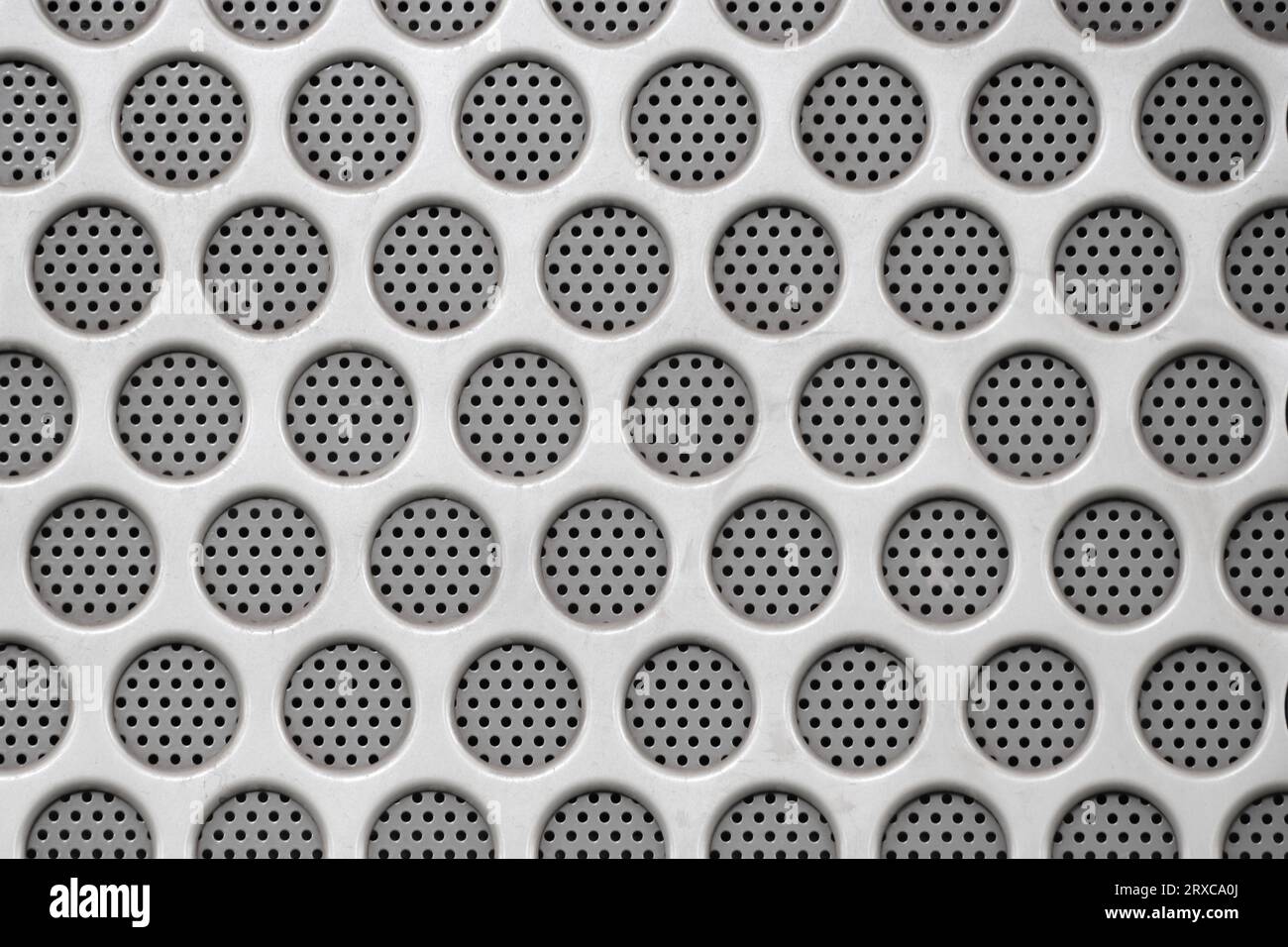 Background of a white perforated speaker panel with holes Stock Photo ...