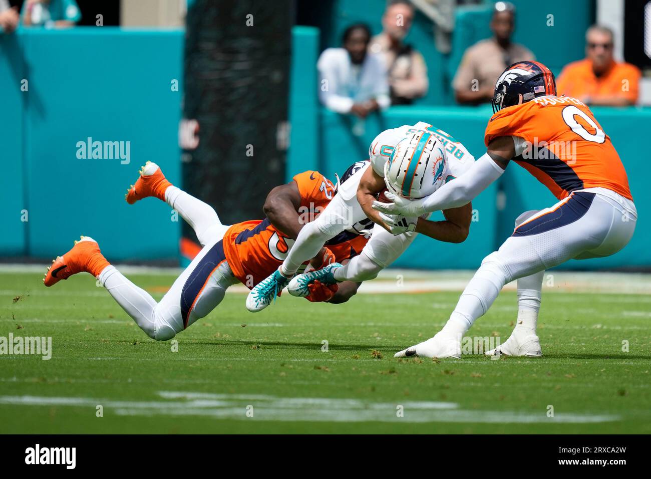 Denver Broncos linebacker Jonathon Cooper (0) and safety Delarrin ...