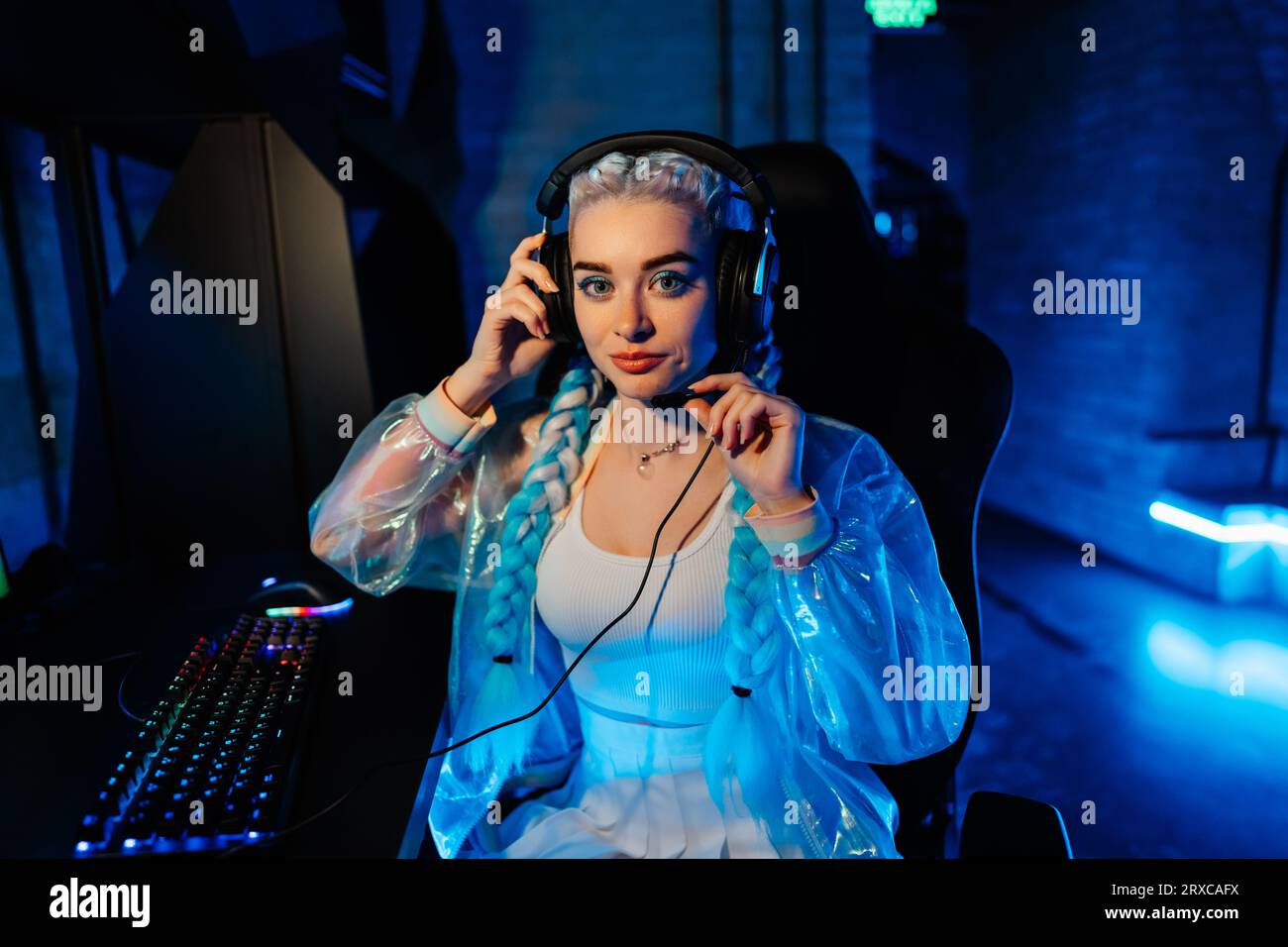 Young female cyber gamer, cosplayer plays computer games Stock Photo ...