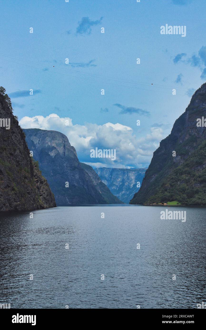 Aurlandsfjord. Cliffs surround the river from either side. This creates ...