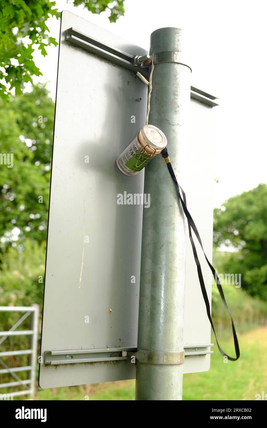 July 2023 - Geocaching containers behind a road sign in rural Somerset ...