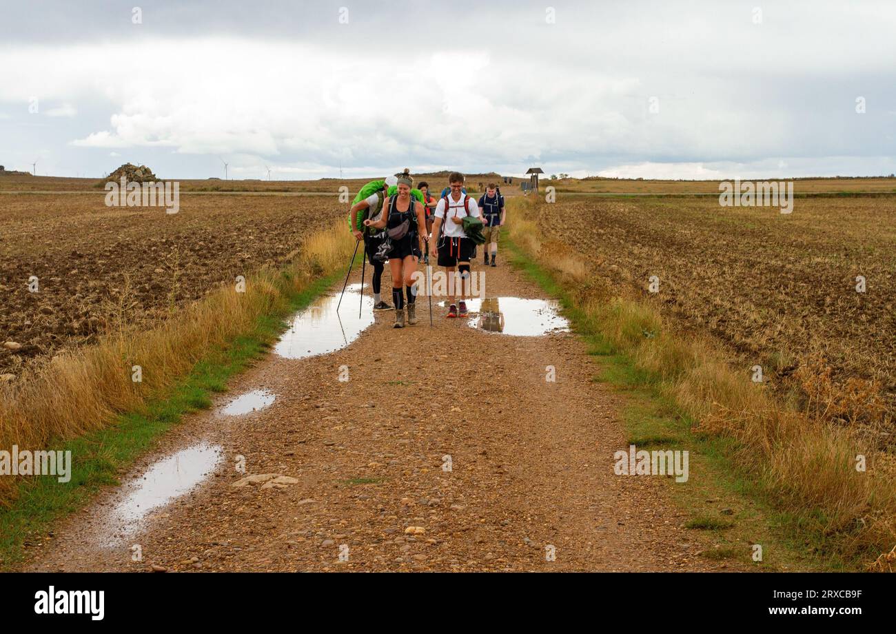 Pilgrims walking the Camino de Santiago pilgrimage route, the way of St ...