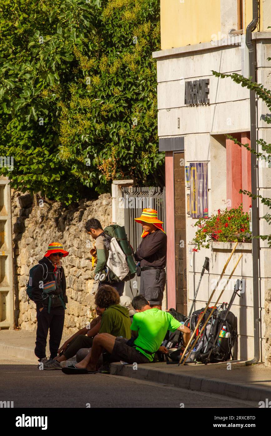 Pilgrims walking the Camino de Santiago pilgrimage route the way of St ...