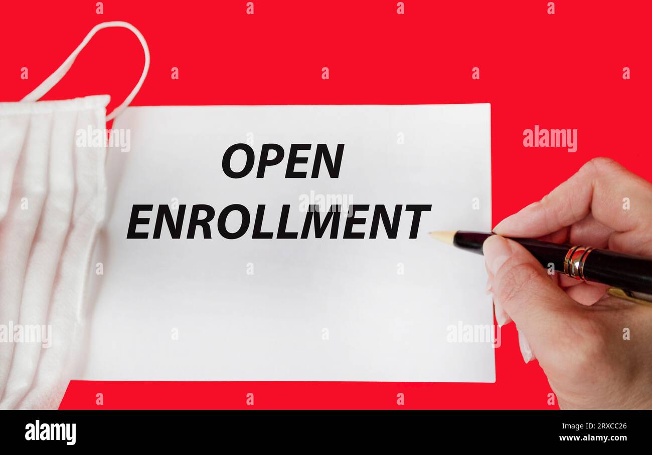 Open registration. Text and woman's hand holding pen on notepad Stock ...