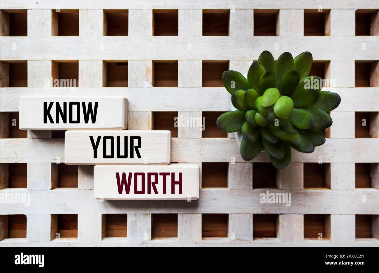 Know your worth on wooden blocks and vintage background.Self motivation ...
