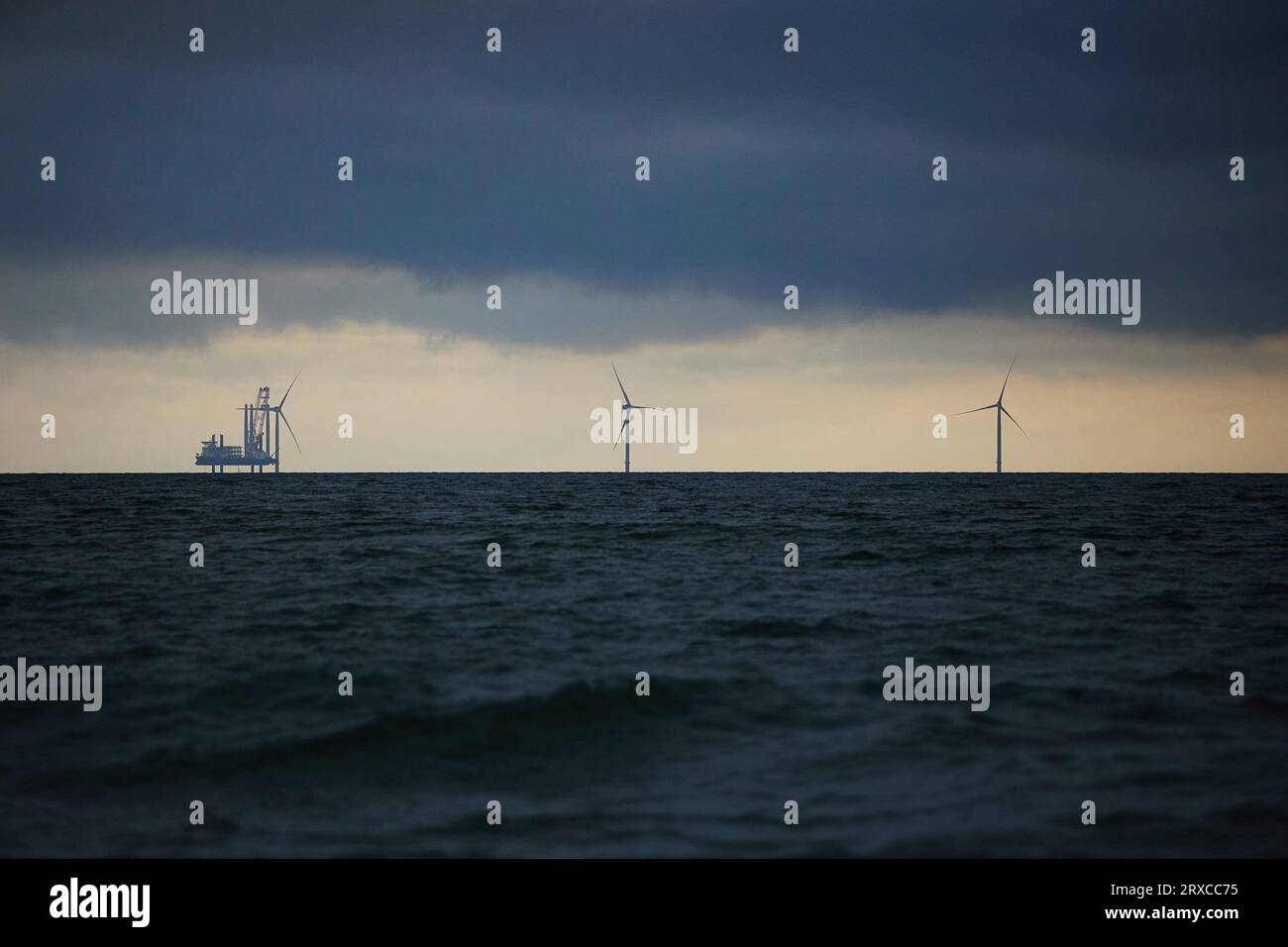 Station for installing a wind generator at sea. Evening in Denmark ...