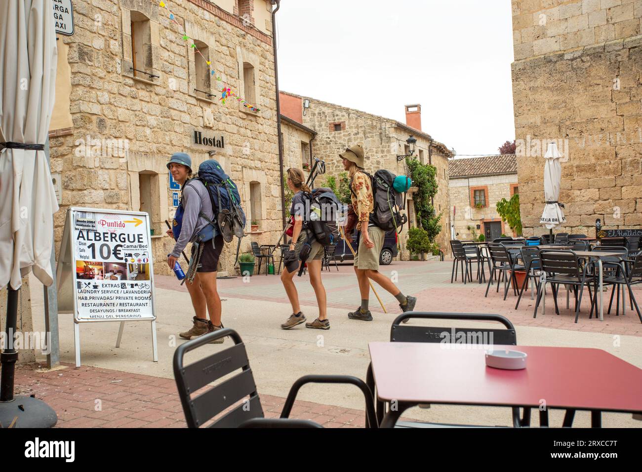 Pilgrims walking the Camino de Santiago pilgrimage route the way of St ...