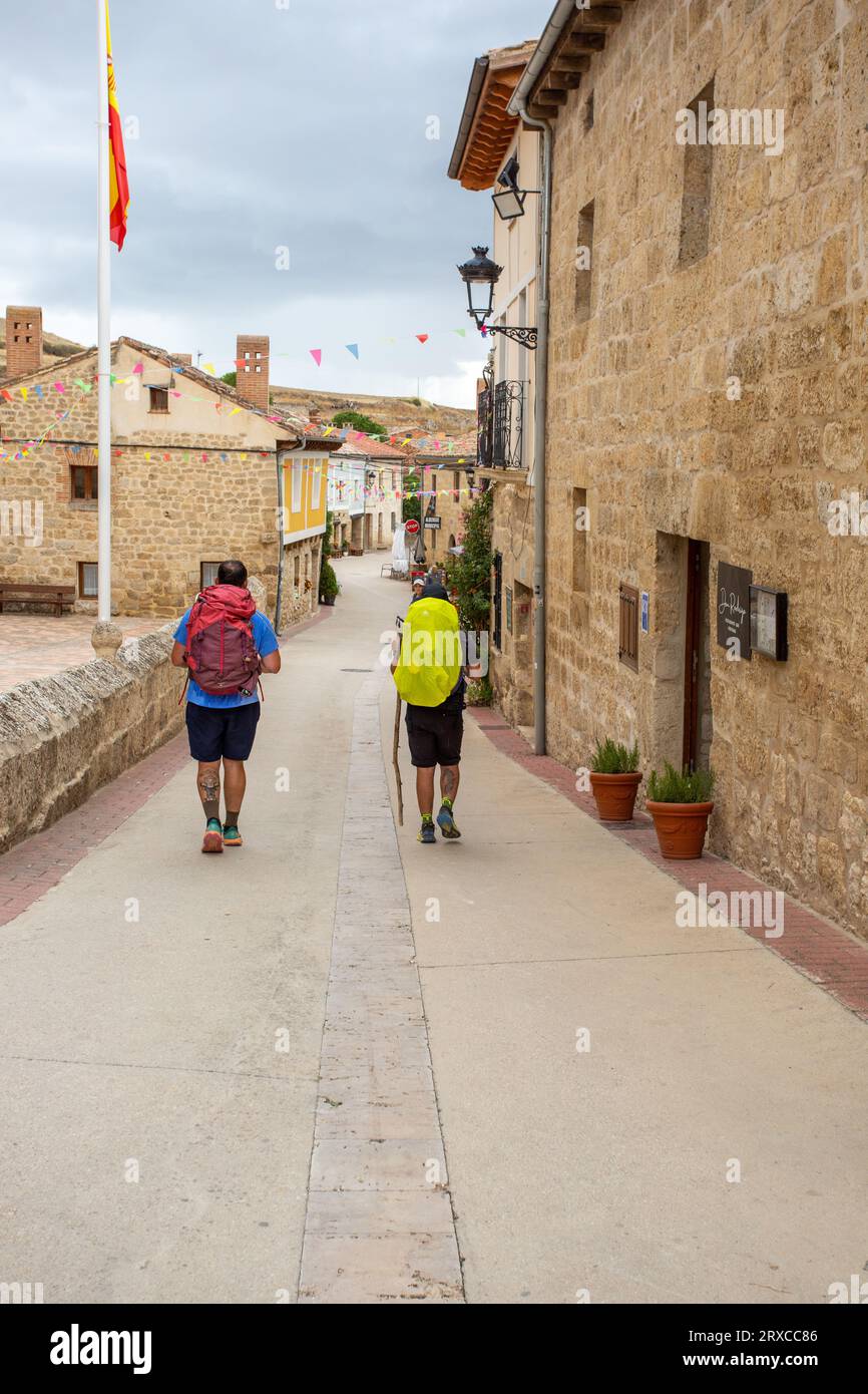 Pilgrims walking the Camino de Santiago pilgrimage route the way of St ...