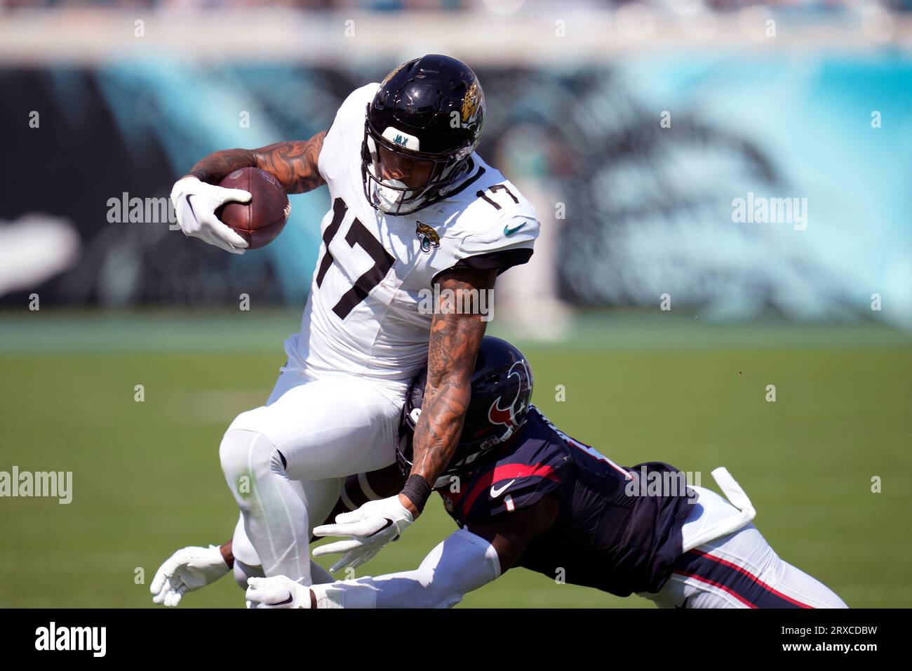 Jacksonville Jaguars tight end Evan Engram (17) is hit by Houston ...