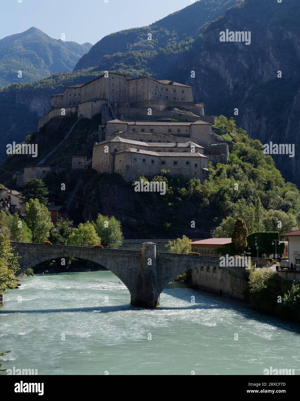 Forte di Bard (Fort of Bard) with alps behind and with bridge over the ...