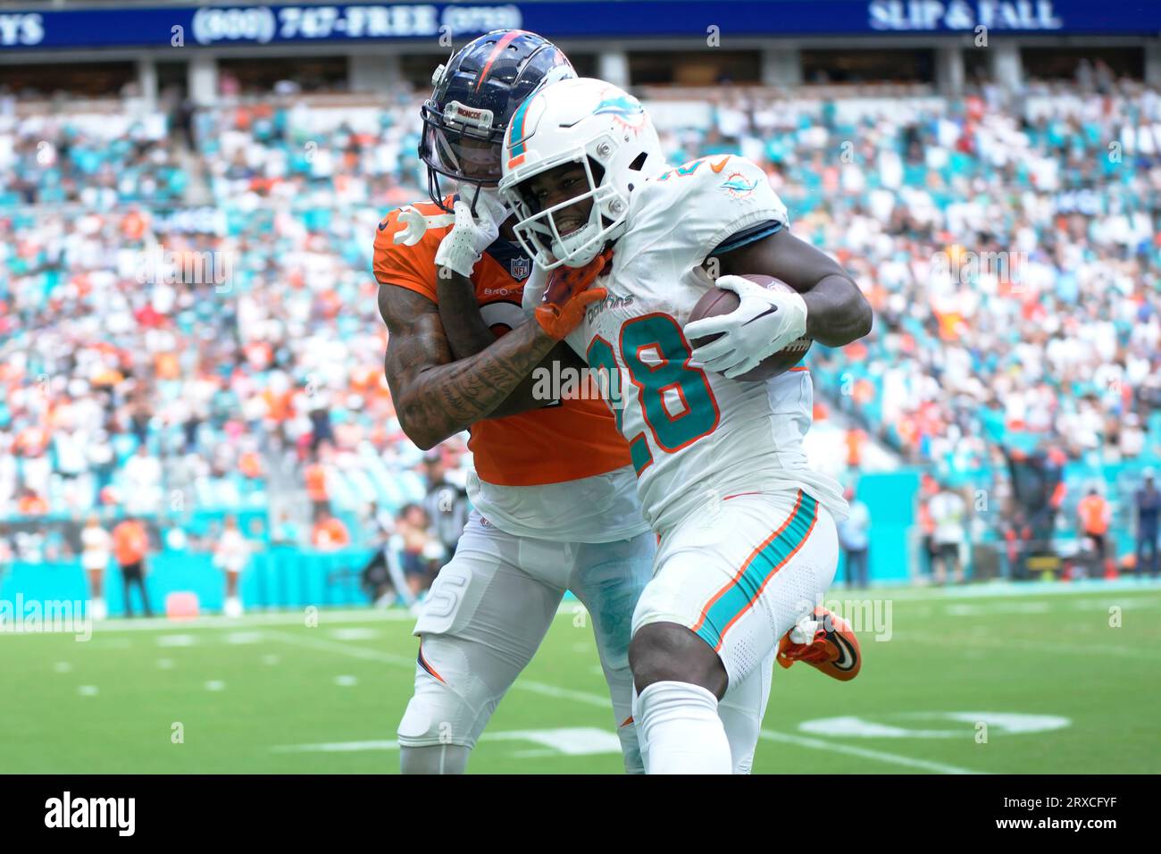 Denver Broncos cornerback Pat Surtain II (2) tackles Miami Dolphins ...