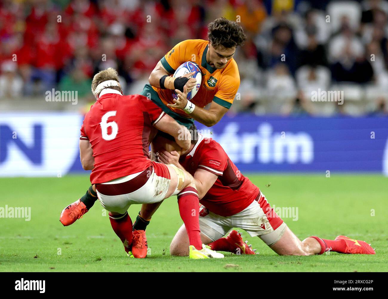Australia's Jordan Petaia is tackled by Wales' Aaron Wainwright (left ...