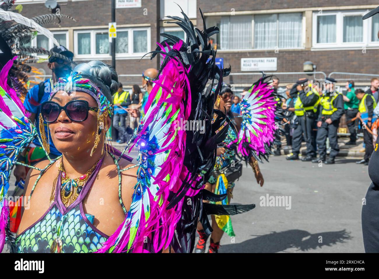 NOTTING HILL, LONDON, ENGLAND - 28 August 2023: Performers wearing ...