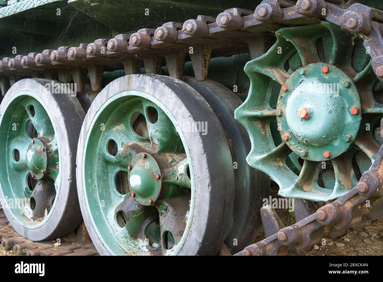 Old tank with green painted tracks Stock Photo - Alamy