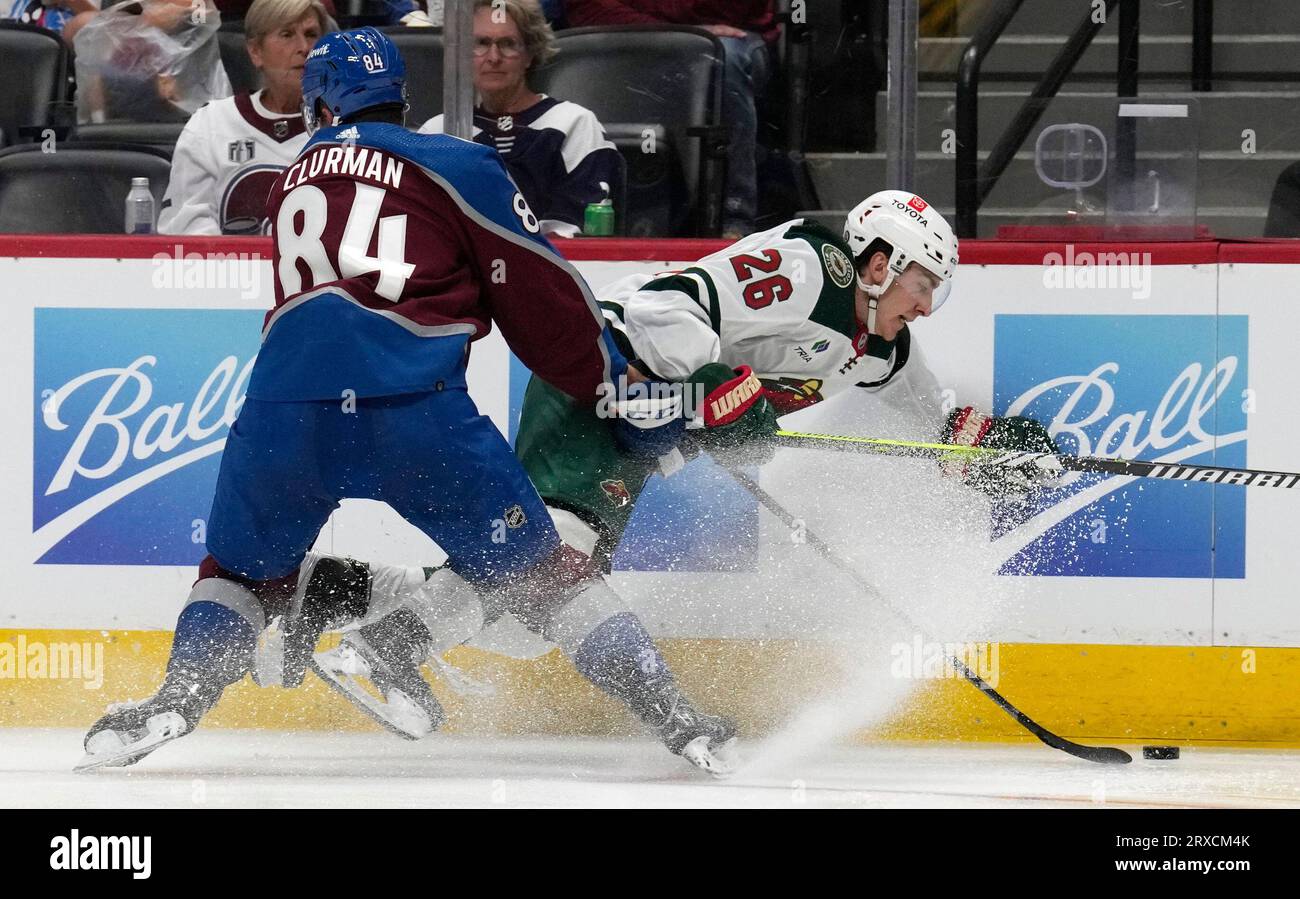 Colorado Avalanche defenseman Nate Clurman, left, checks Minnesota Wild ...