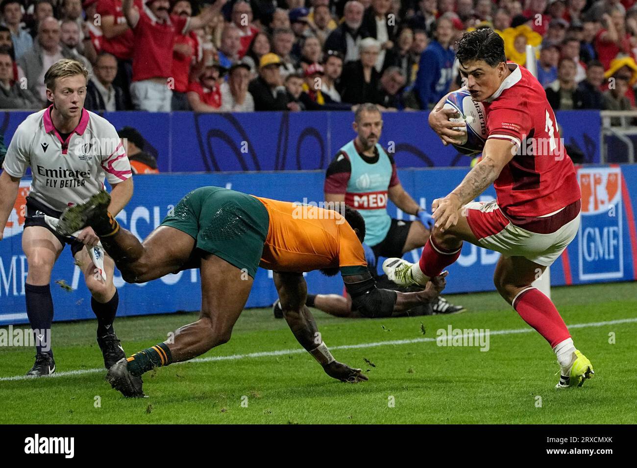 Wales' Louis Rees-Zammit is tackled by Australia's Tom Hooper during a ...