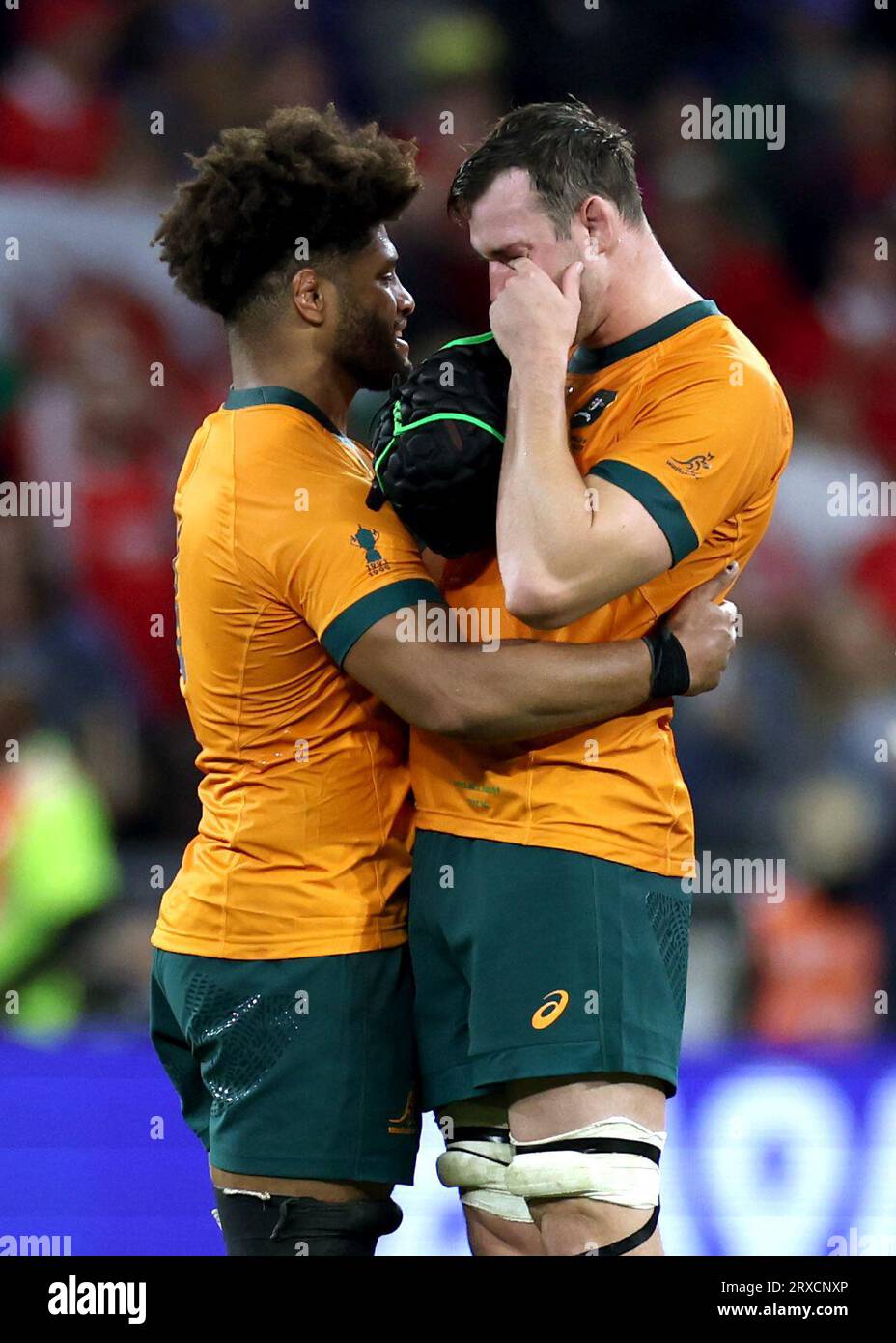 Australia's Nick Frost (right) is consoled by Australia's Rob Valentini ...