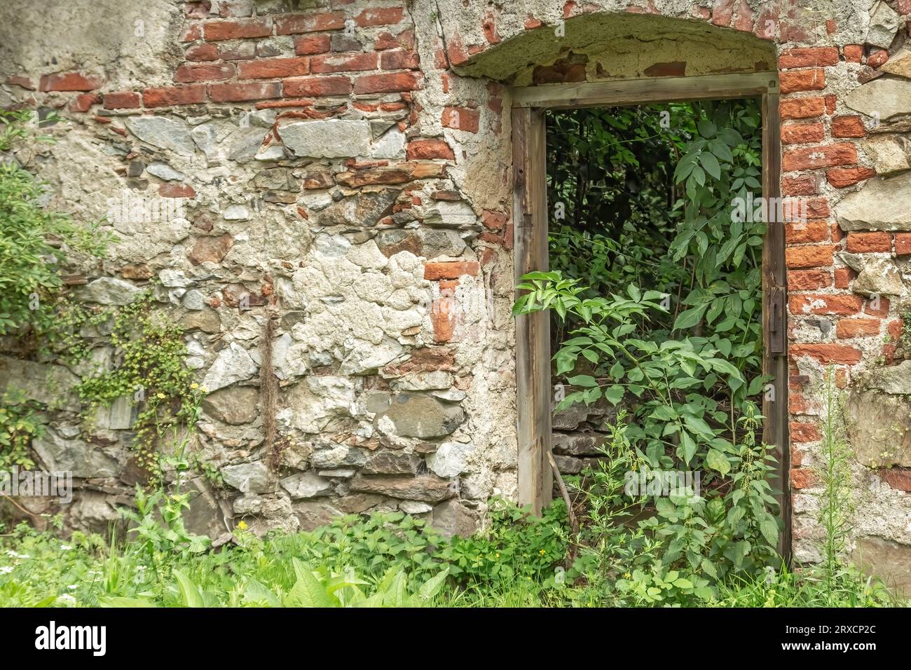 Wooden freame in old brick and stone wall background. Horizontally ...
