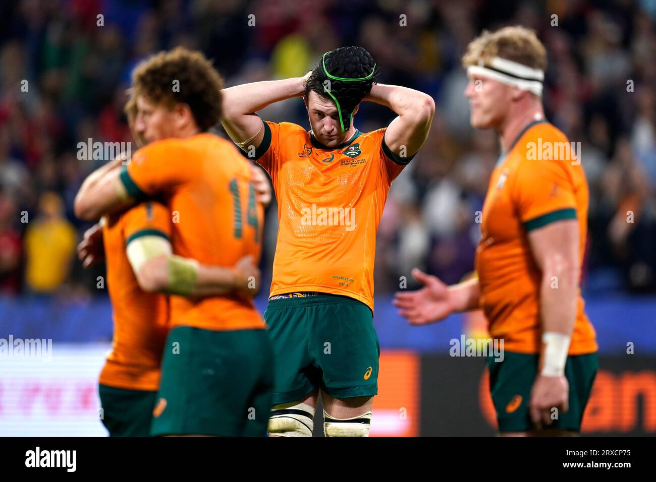 Australia's Nick Frost (centre) looks dejected following defeat in the ...