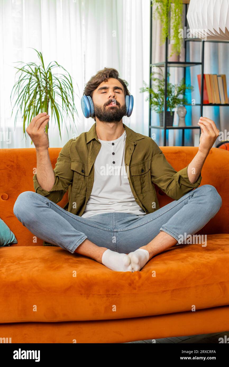 Keep calm down, relax. Middle eastern arabian man listening music ...