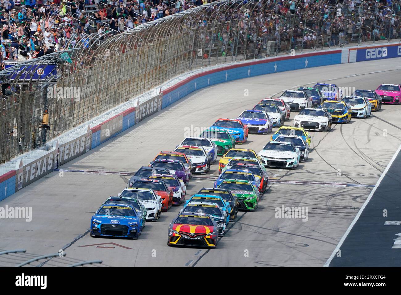 The green flag starts a NASCAR Cup Series auto race at Texas Motor ...