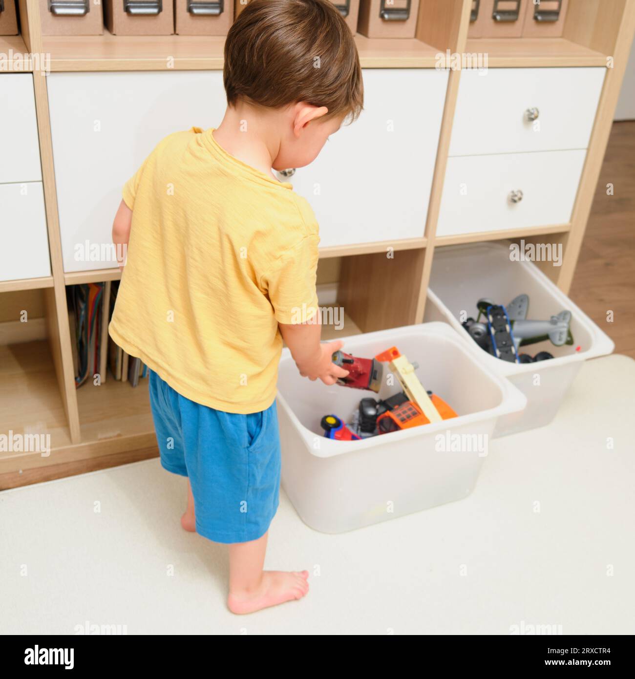 Putting toys back in the box is an important lesson in responsibility ...