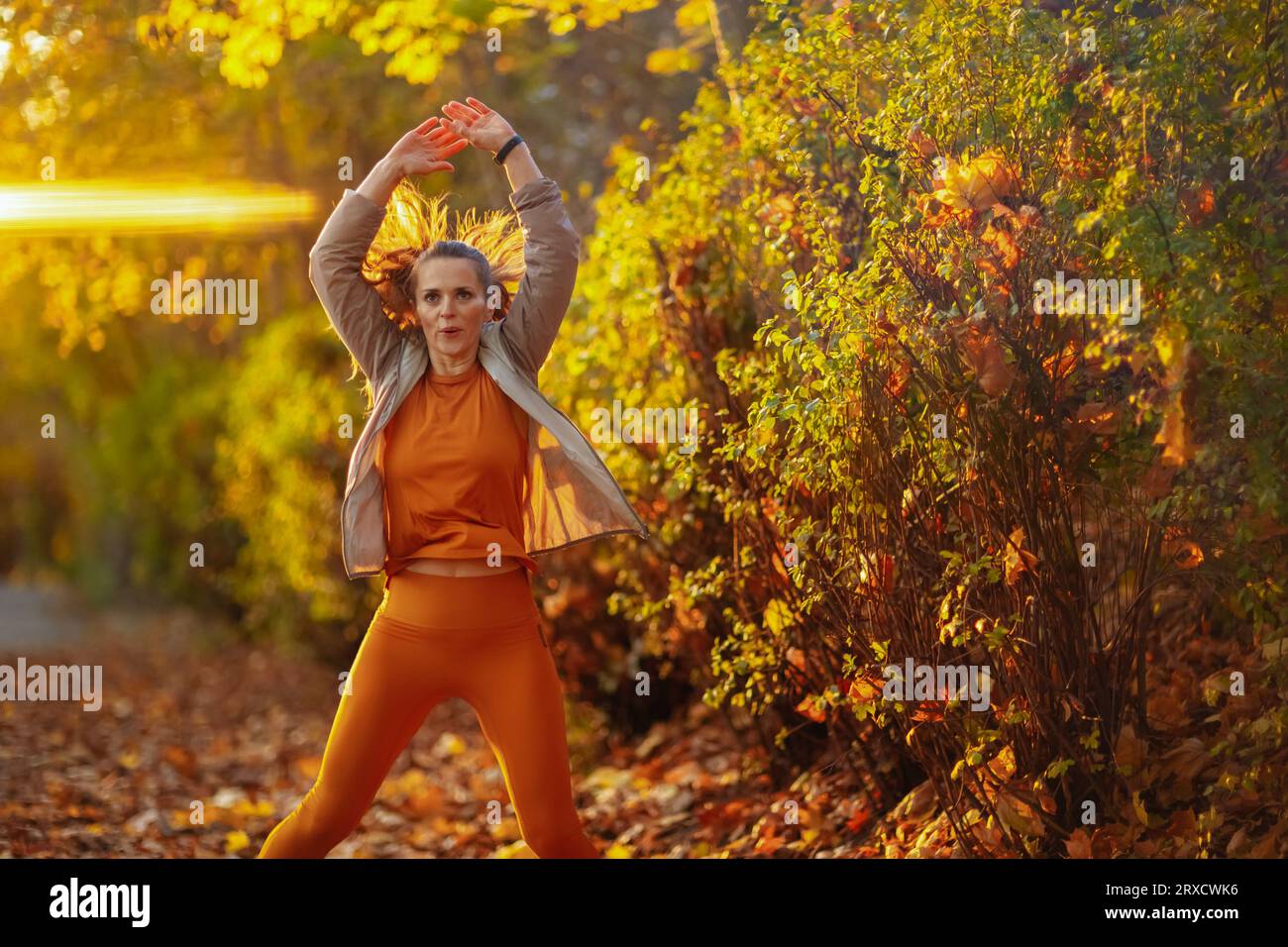 Hello autumn. fit woman in fitness clothes in the park workout Stock ...