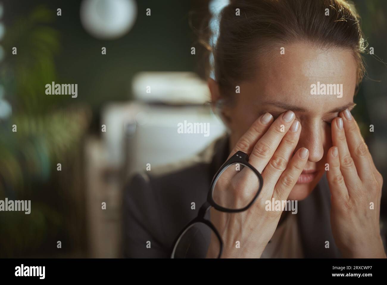 Sustainable workplace. stressed modern business woman in modern green ...